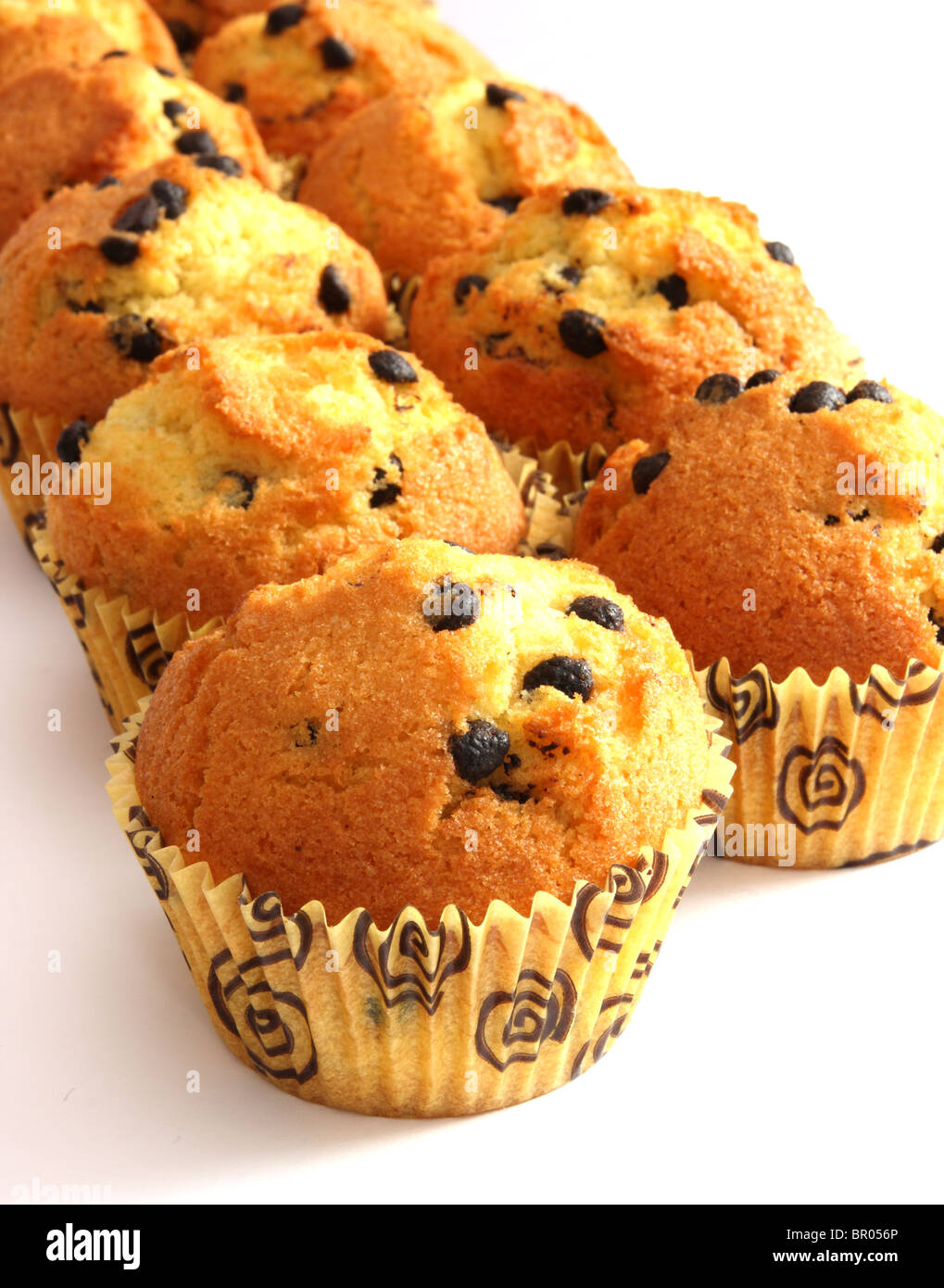 Yellow chocolate chip muffins on white background Stock Photo - Alamy