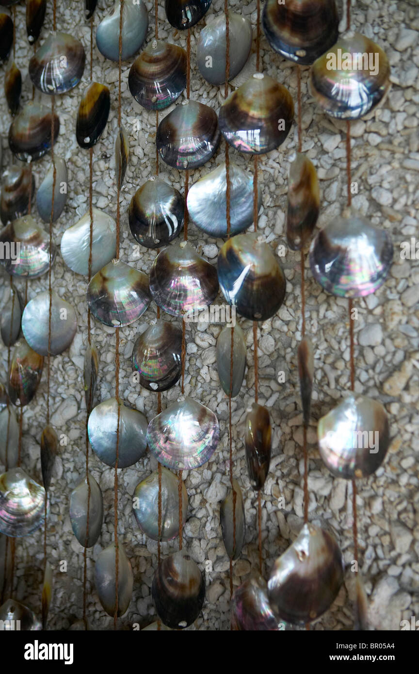 Seashells hanging on string in Bora Bora Stock Photo - Alamy