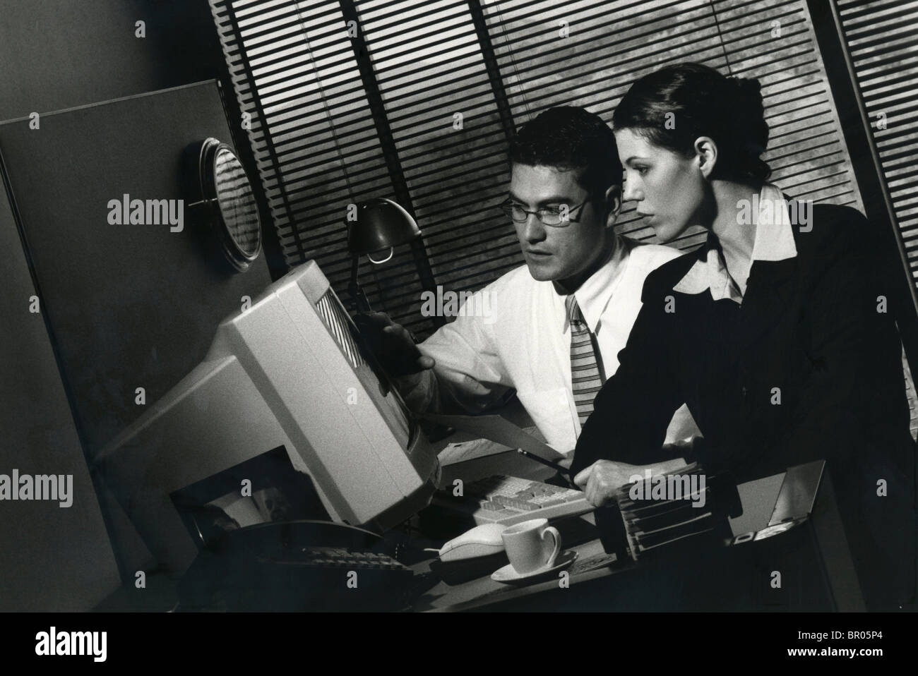Two computer engineers work on a future developmental project for a ...