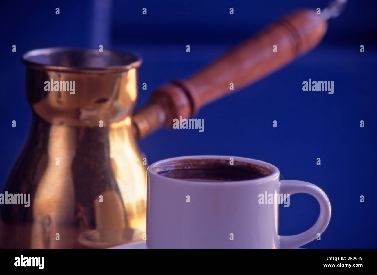 Iconic Cup of strong Greek Coffe and Copper Ibrk Stock Photo - Alamy