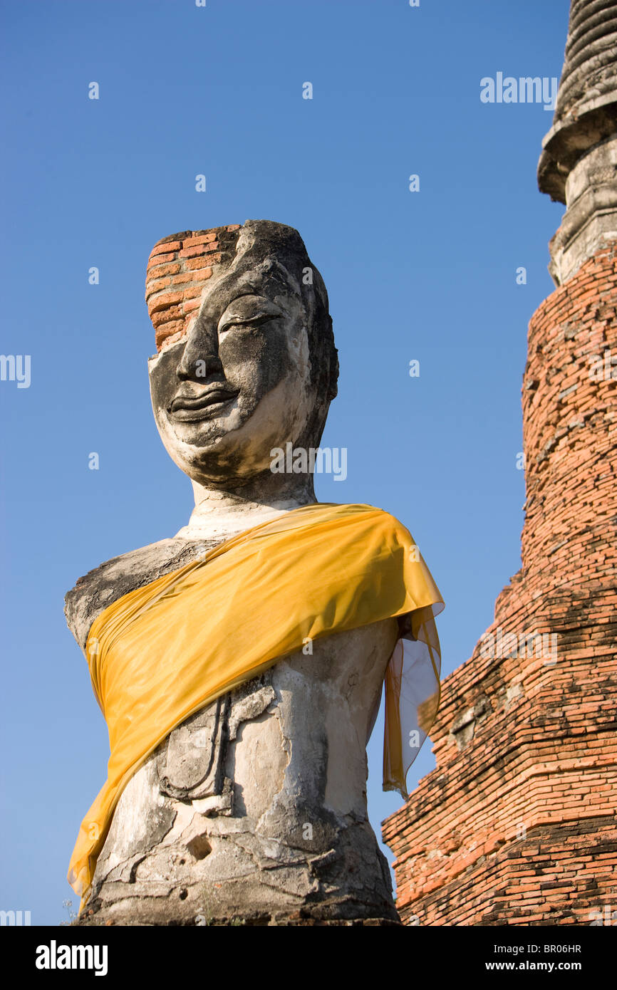 Brick Buddha wapped in Saffron Robe Stock Photo - Alamy