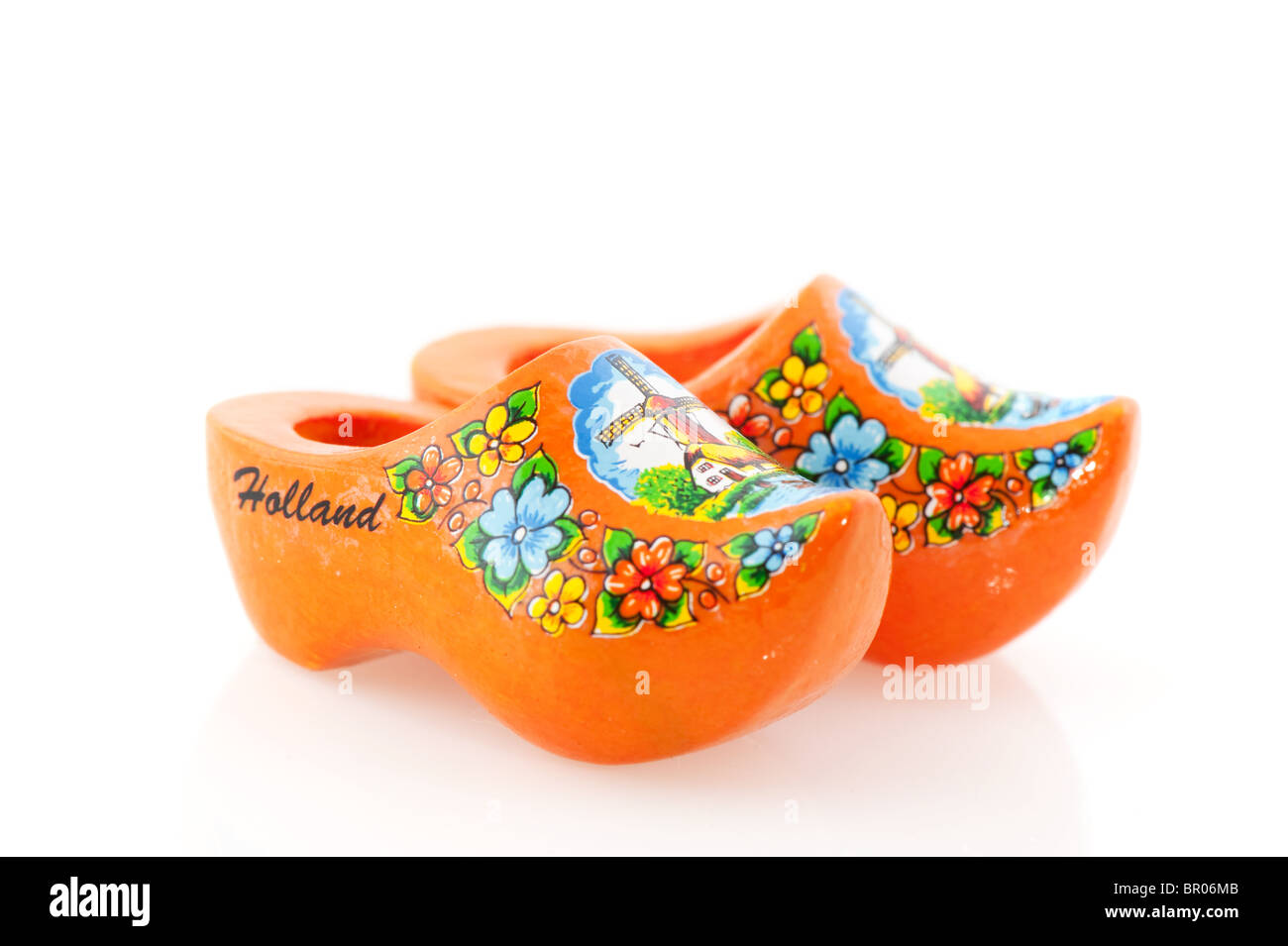 Orange Dutch clogs with Holland isolated over white Stock Photo - Alamy