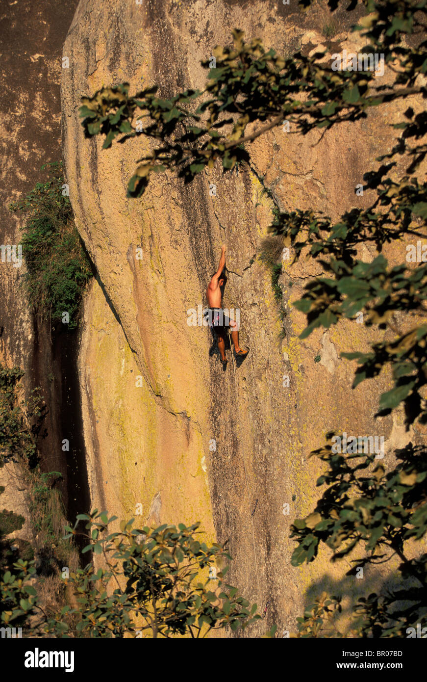 A male rock climber lead climbing a dificult climbing route Stock Photo ...