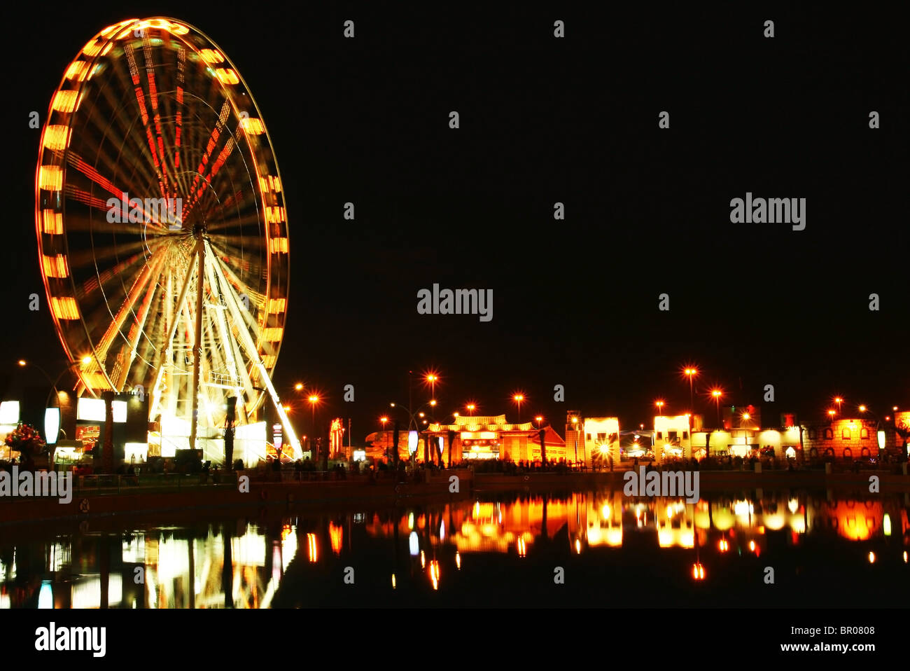 Amusement park at night. conceptual image of entertainment & fun Stock ...