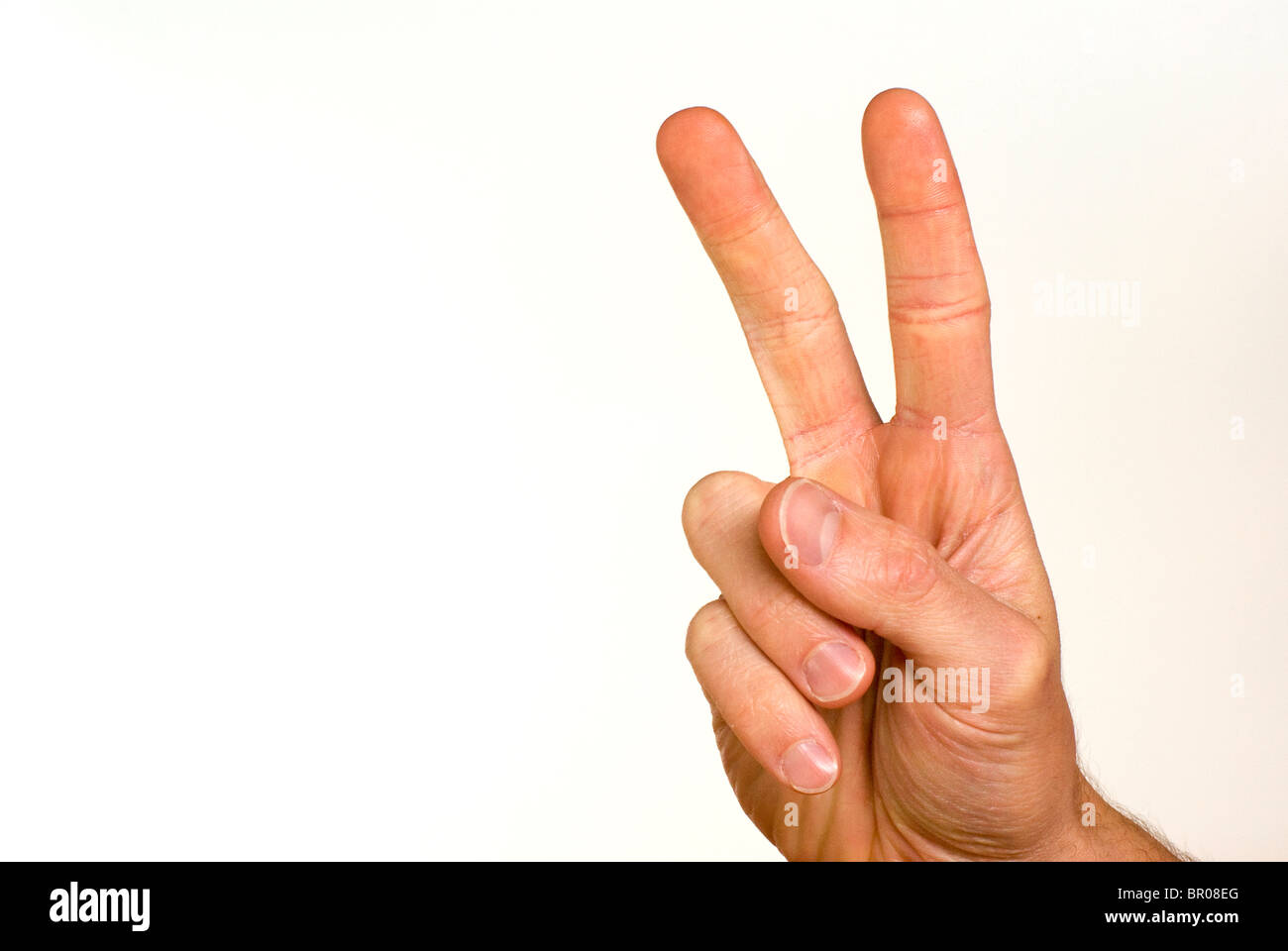 Male hand showing two fingers and peace symbol Stock Photo - Alamy