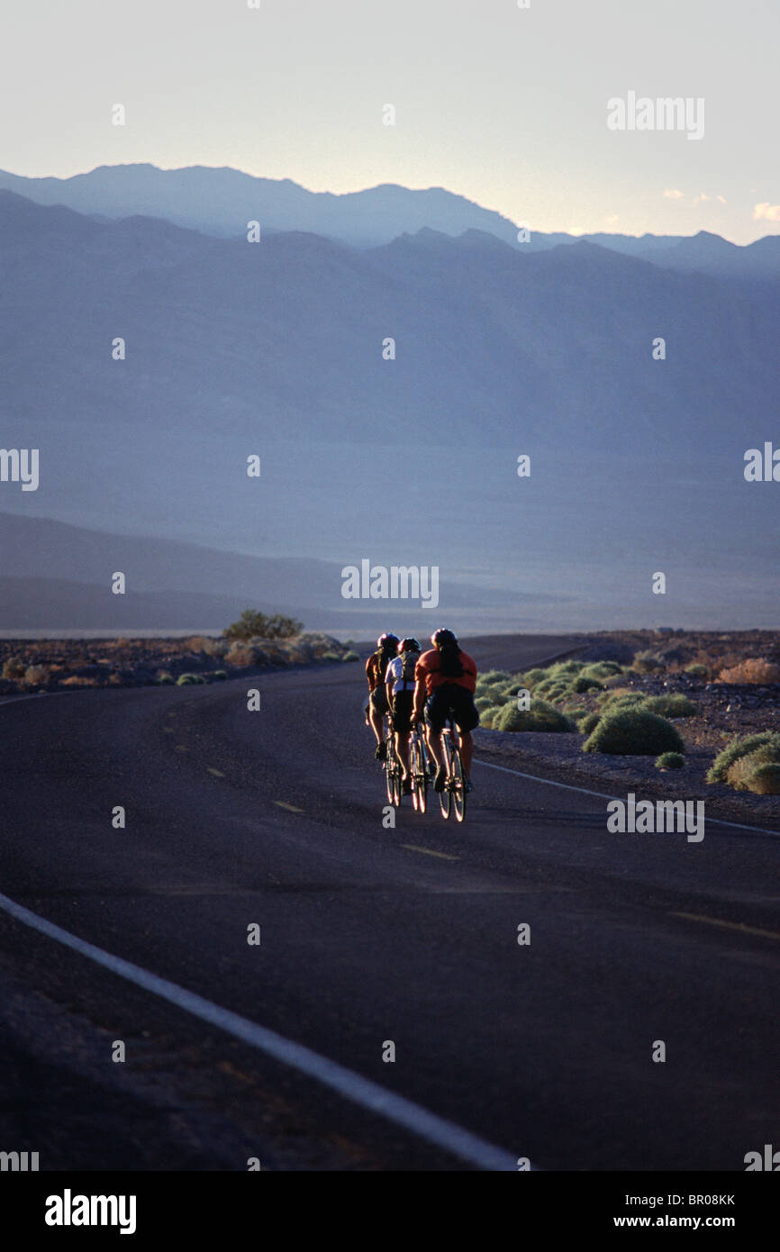Three men cycling in Death Valley Stock Photo - Alamy