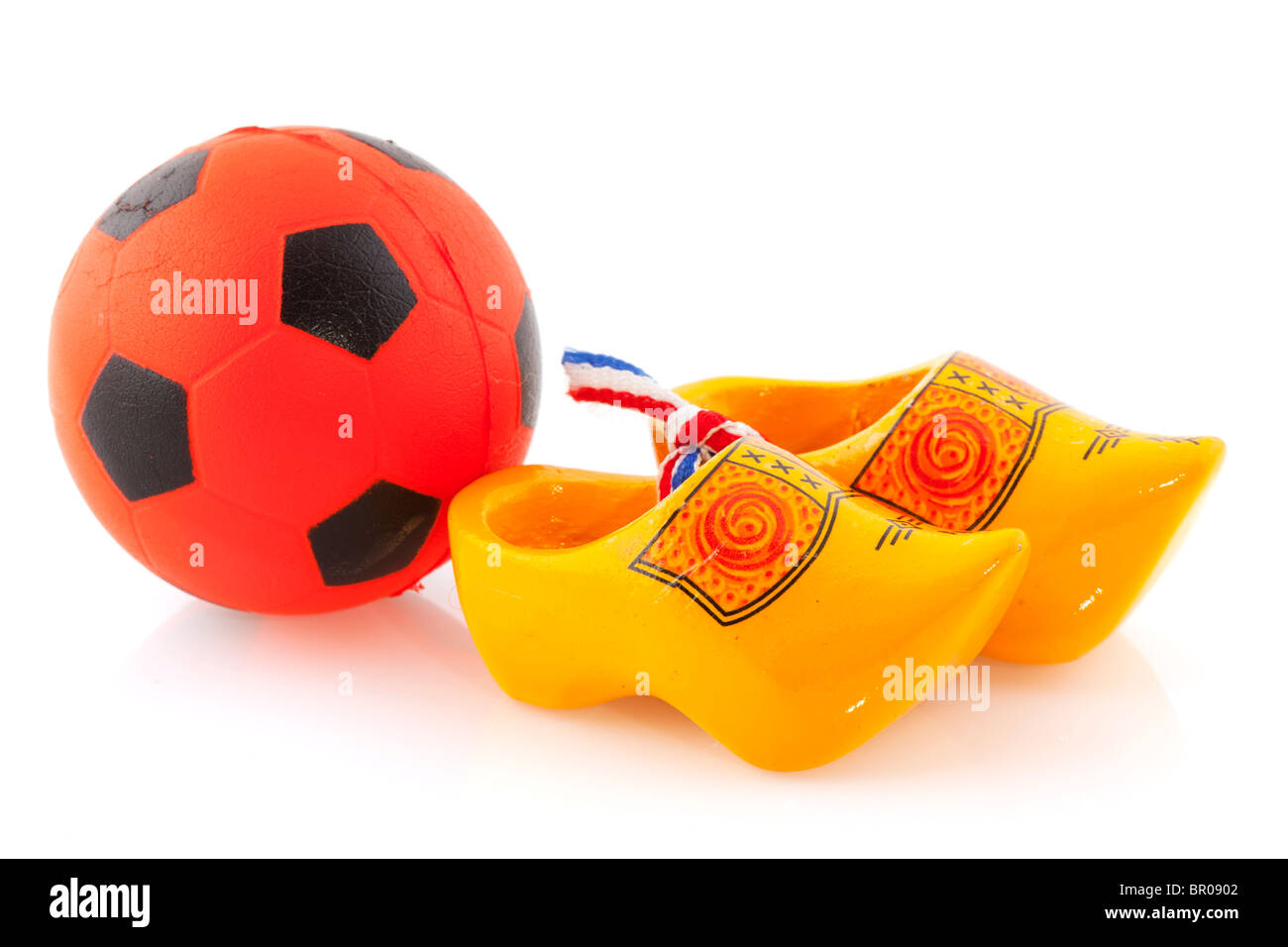 Dutch soccer with ball and wooden clogs Stock Photo - Alamy