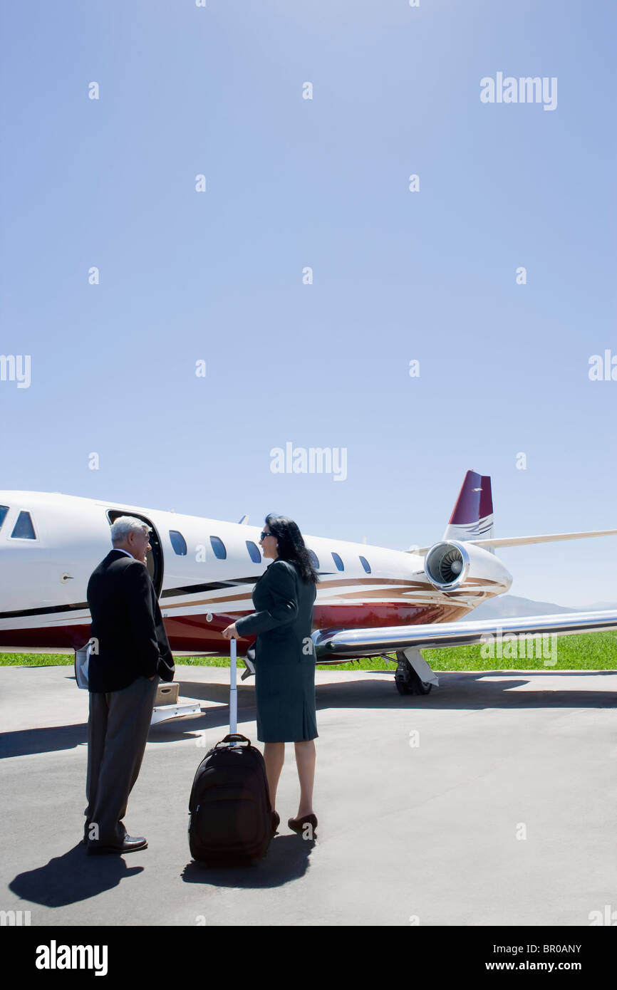 Business people boarding private jet Stock Photo - Alamy