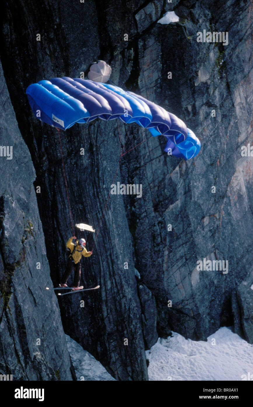 Ski-BASE jumper steering his parachute Stock Photo - Alamy