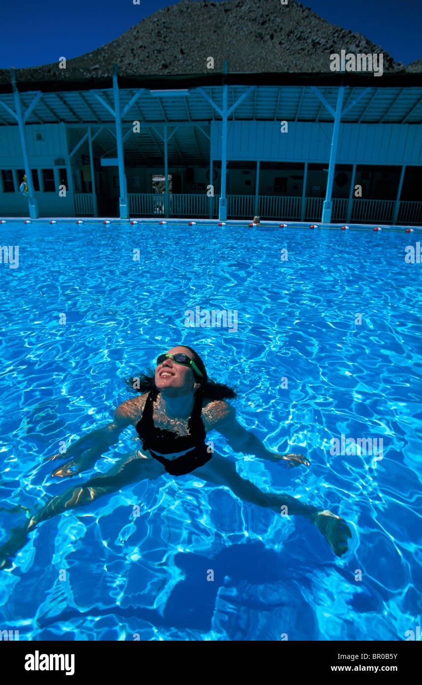 A woman swimming in a pool Stock Photo - Alamy