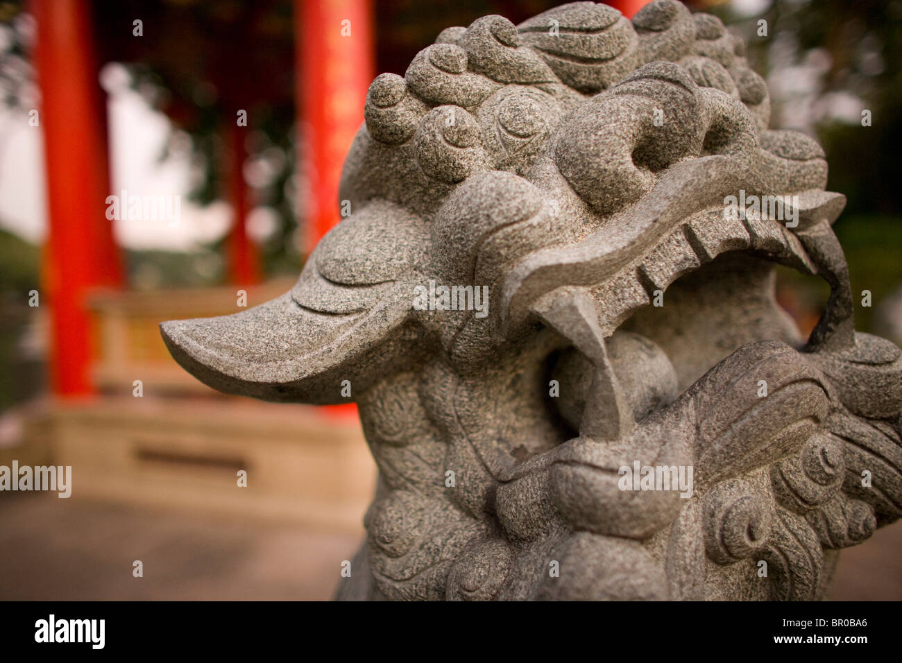 Temple dog at red Pagoda Stock Photo - Alamy