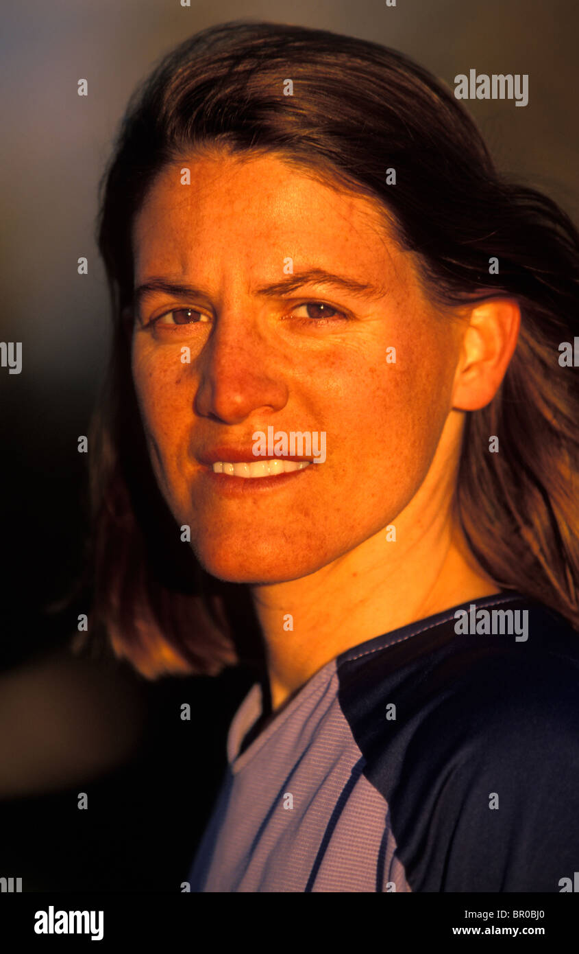 A headshot of a female athlete at sunset Stock Photo - Alamy