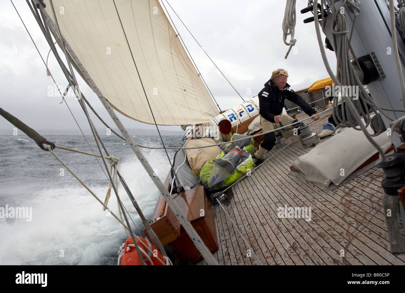 A yacht in heavy winds while sailing through the Caledonian Canal ...