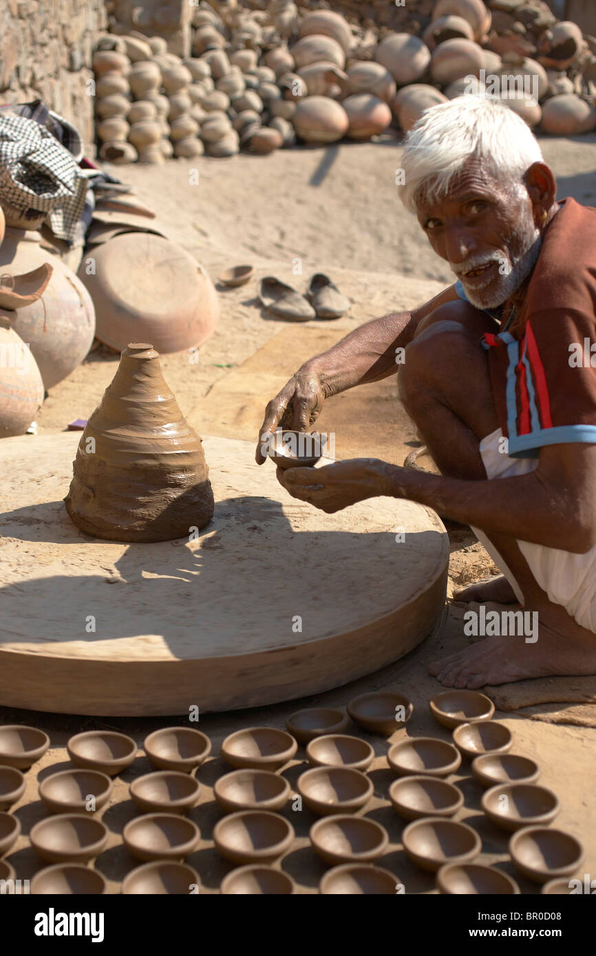 Hands turning clay pots in the village of Mandawa Stock Photo - Alamy