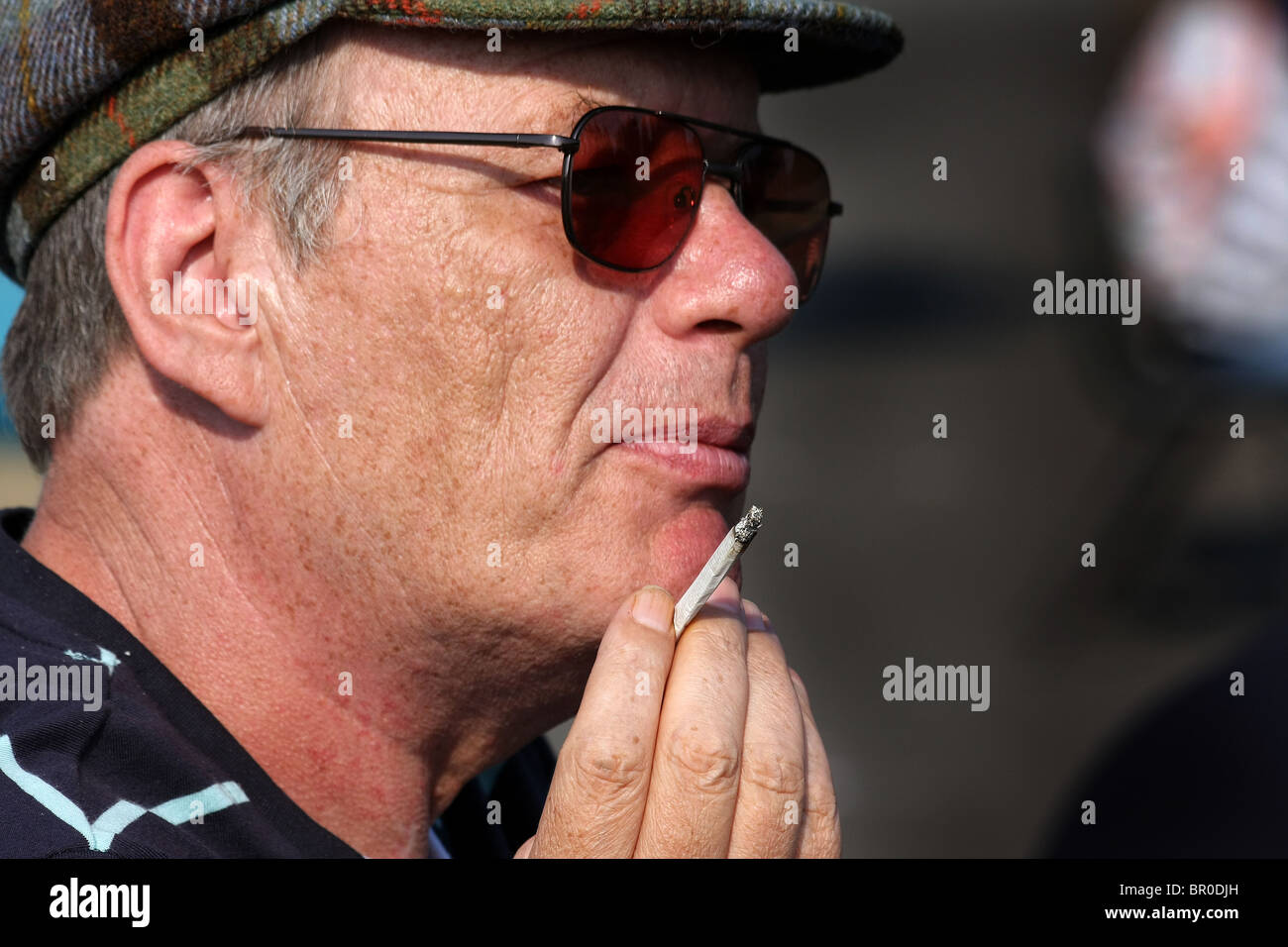 Close image of man smoking cigarette Stock Photo - Alamy