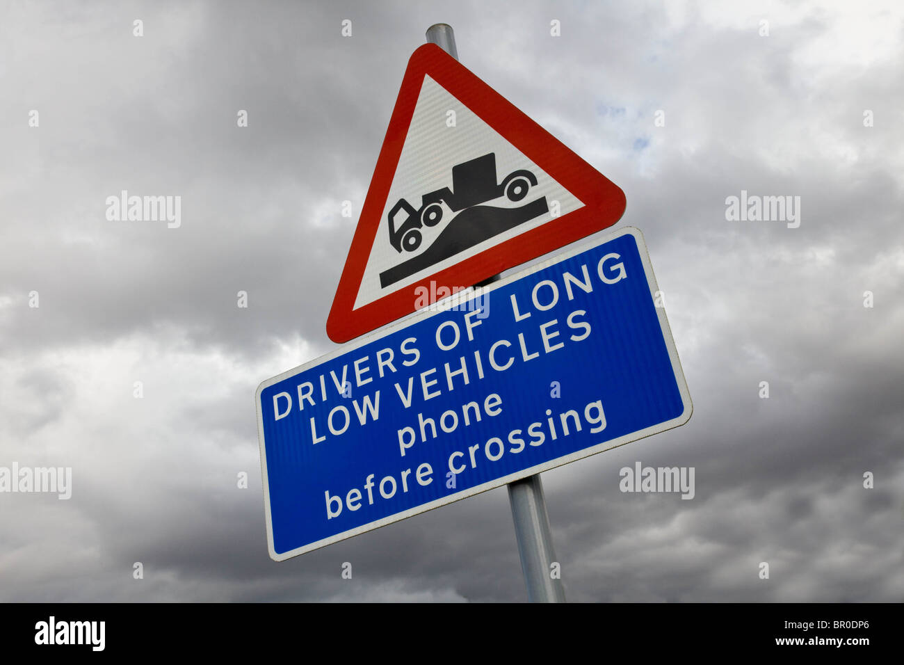 Risk of grounding sign for long low vehicles on a railway crossing ...