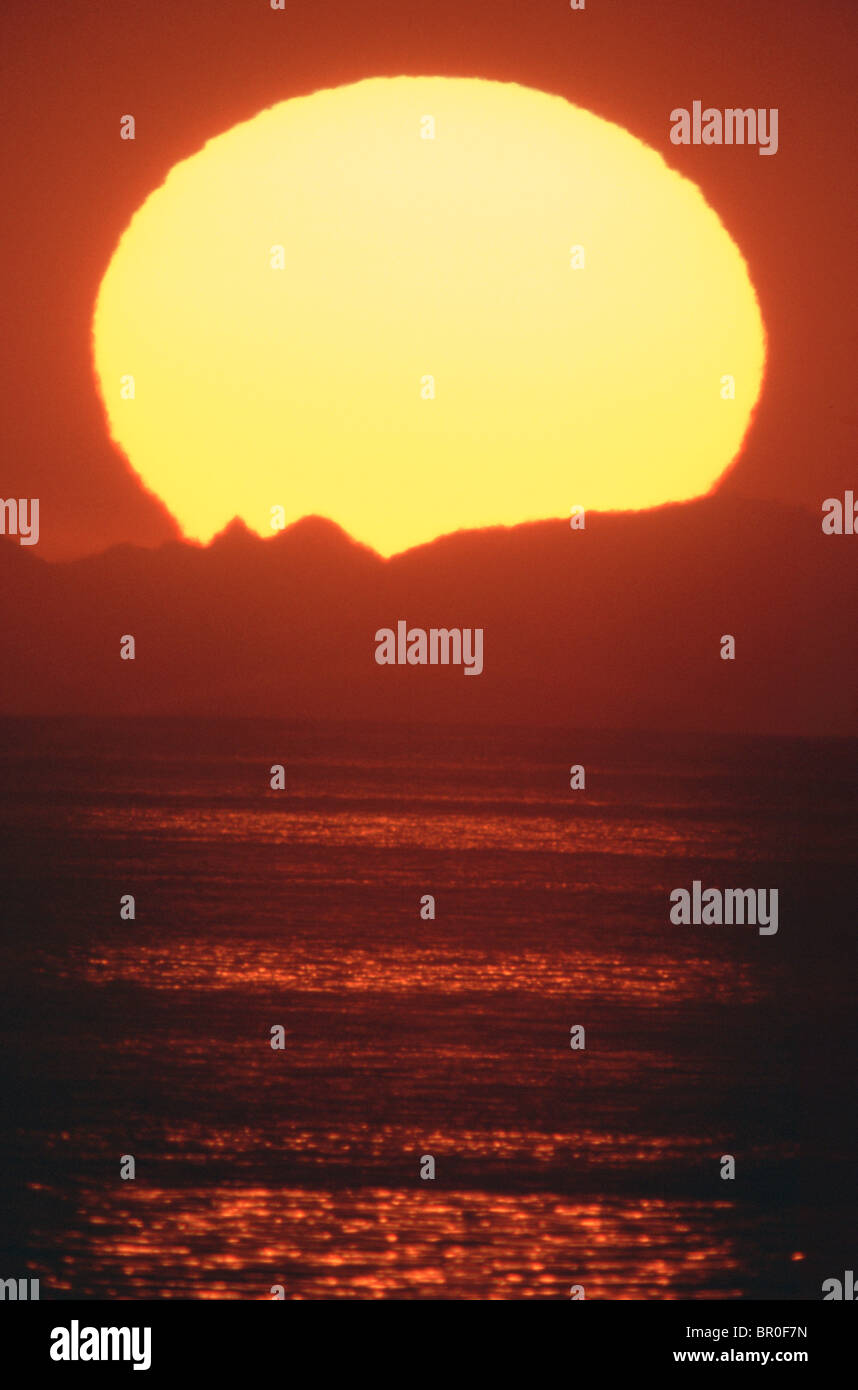 Giant sun on horizon Stock Photo - Alamy