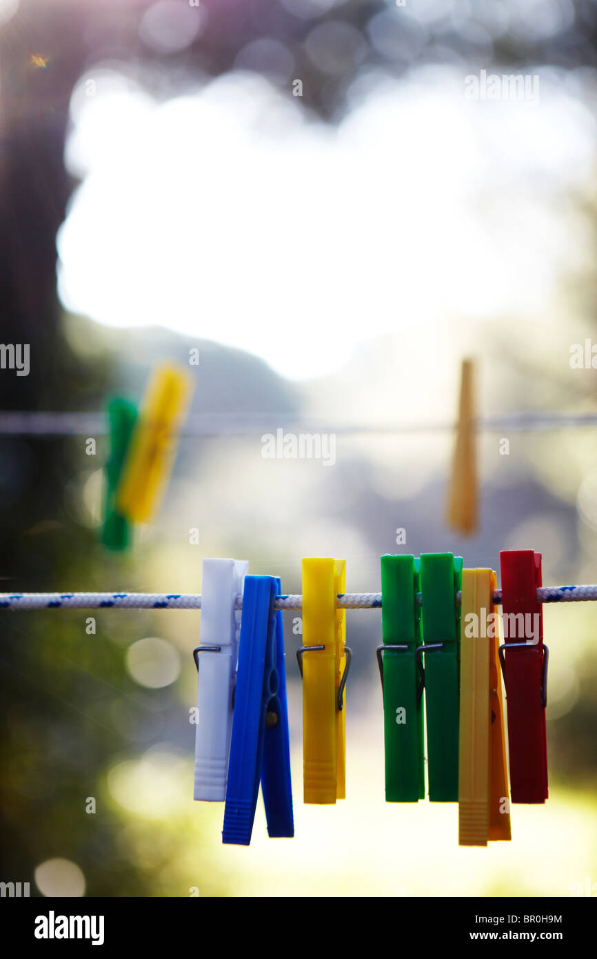 Coloured pegs on a washing line Stock Photo - Alamy