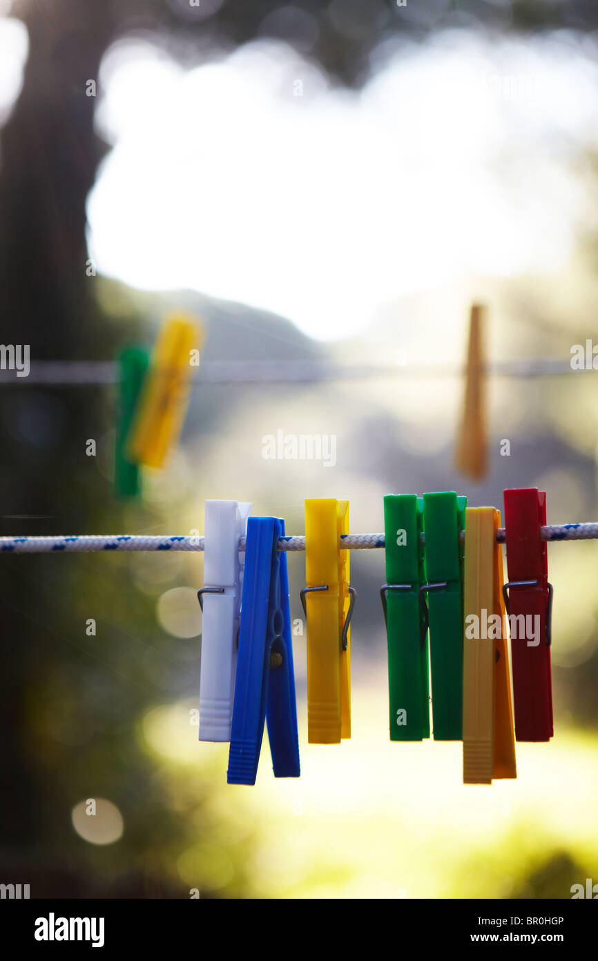 Coloured pegs on a washing line Stock Photo - Alamy
