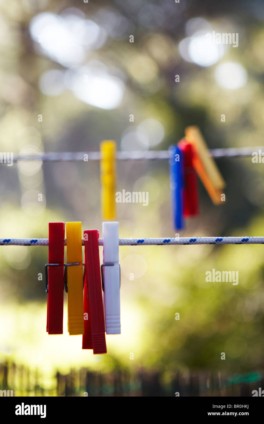 Coloured pegs on a washing line Stock Photo - Alamy