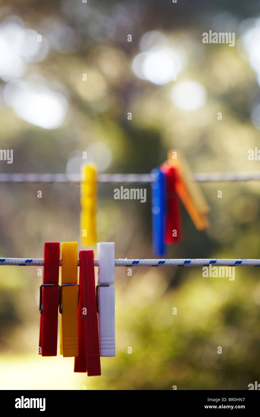 Coloured pegs on a washing line Stock Photo - Alamy