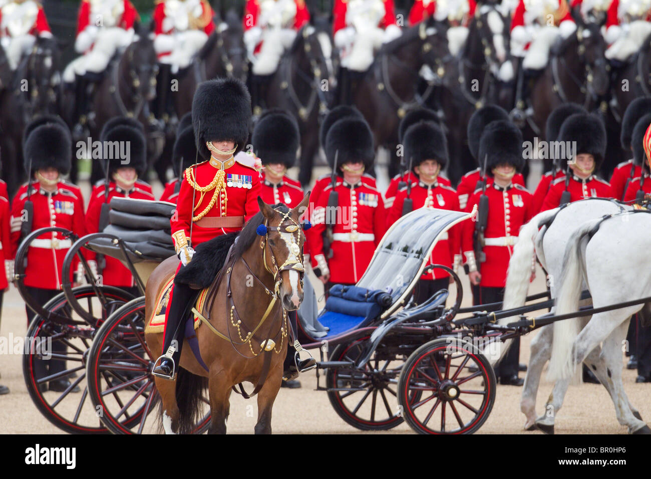 Her Majesty inspecting the line, behind the Field Officer. "Trooping ...