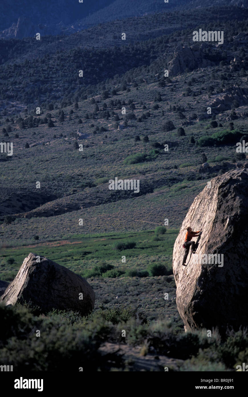 A man bouldering in the desert on a cool fall day Stock Photo - Alamy