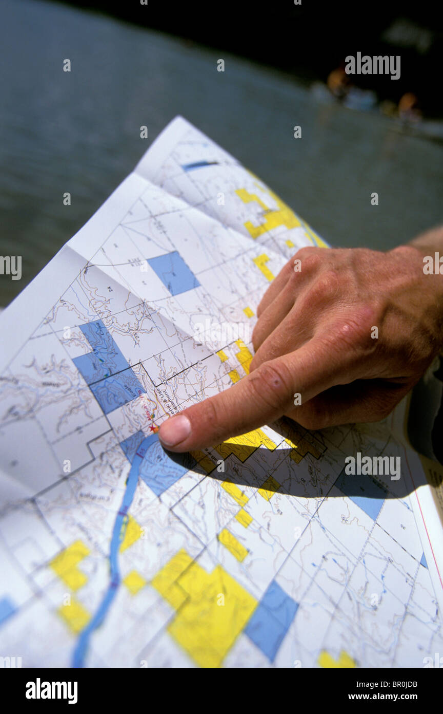 A mans finger points at something on a map Stock Photo - Alamy