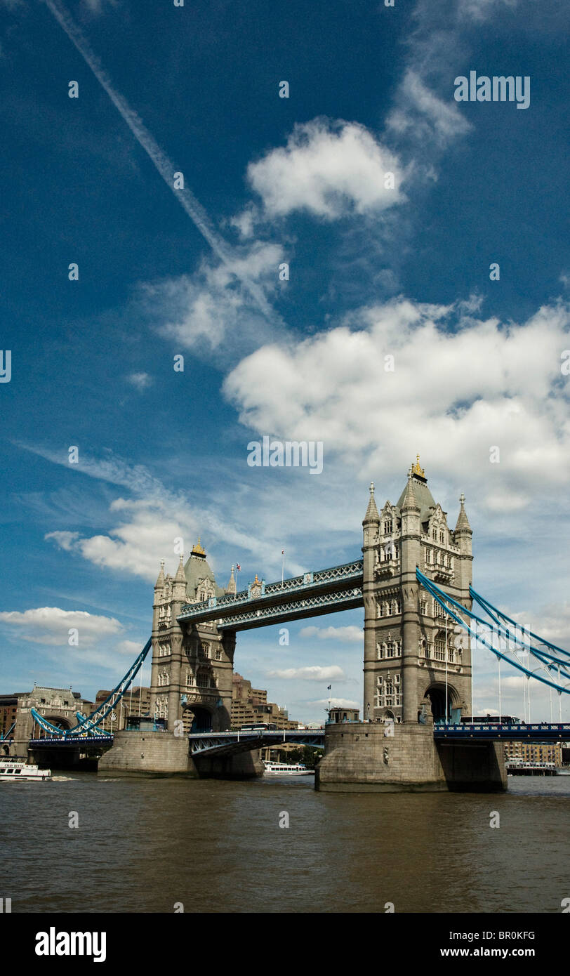 Tower Bridge London and river Thames portrait with jet contrails in the ...