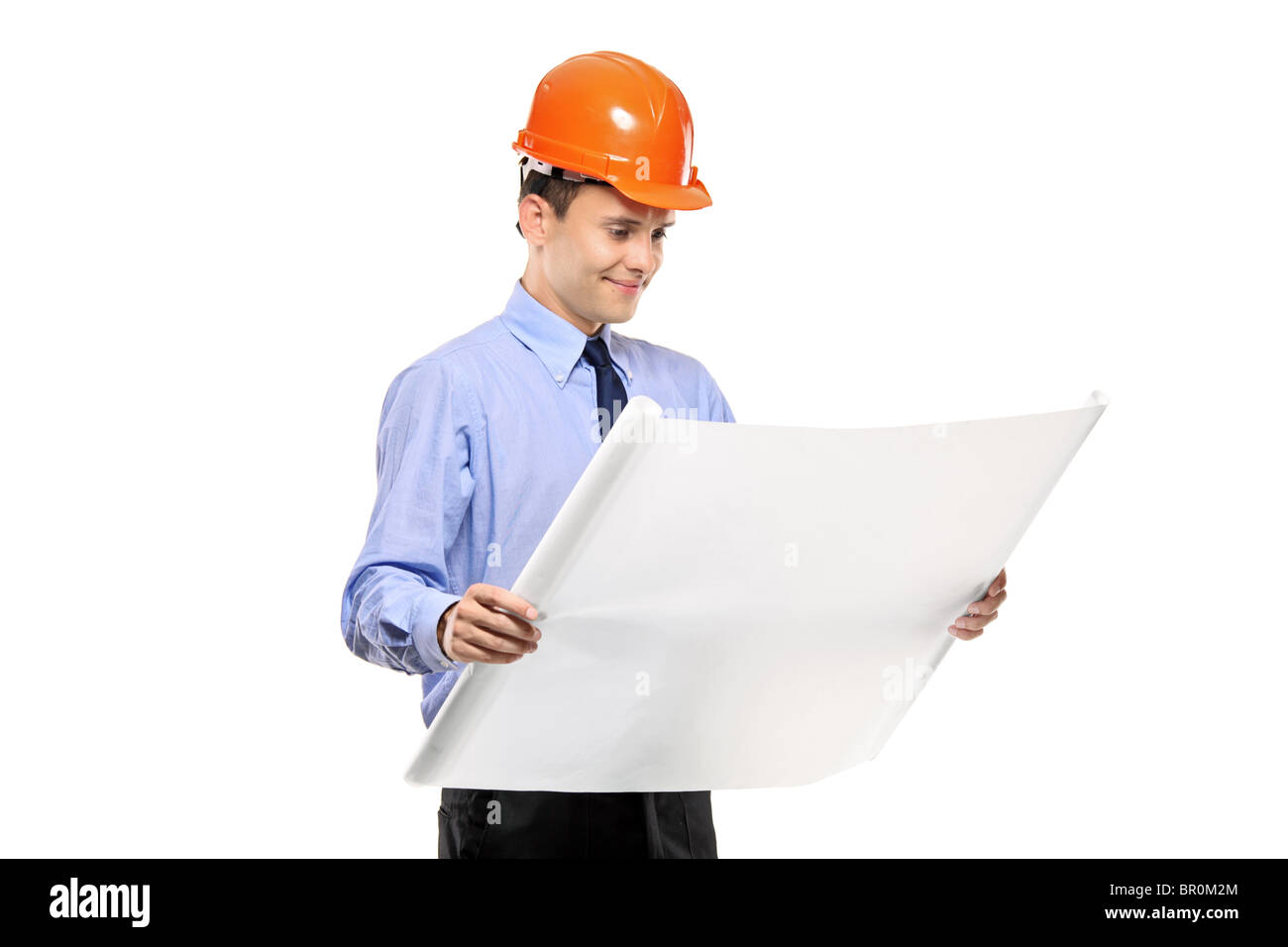 Construction worker looking at blueprints Stock Photo - Alamy