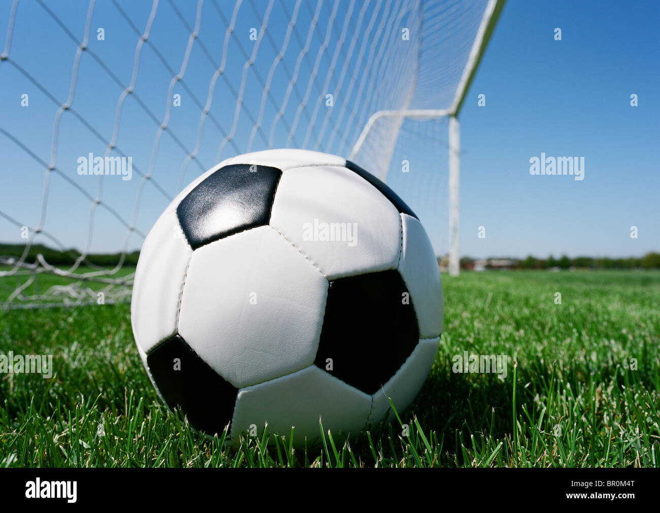 Football in the goal net Stock Photo - Alamy