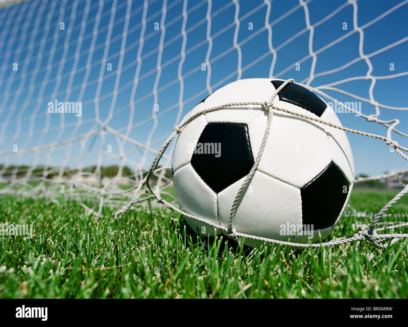 Football in the goal net Stock Photo - Alamy