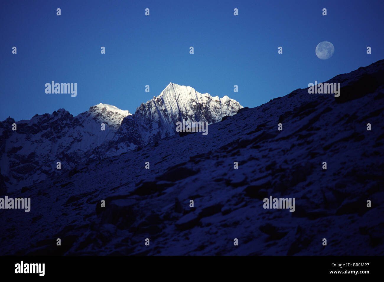 A fll moon over the Himalaya mountains in Nepal Stock Photo - Alamy