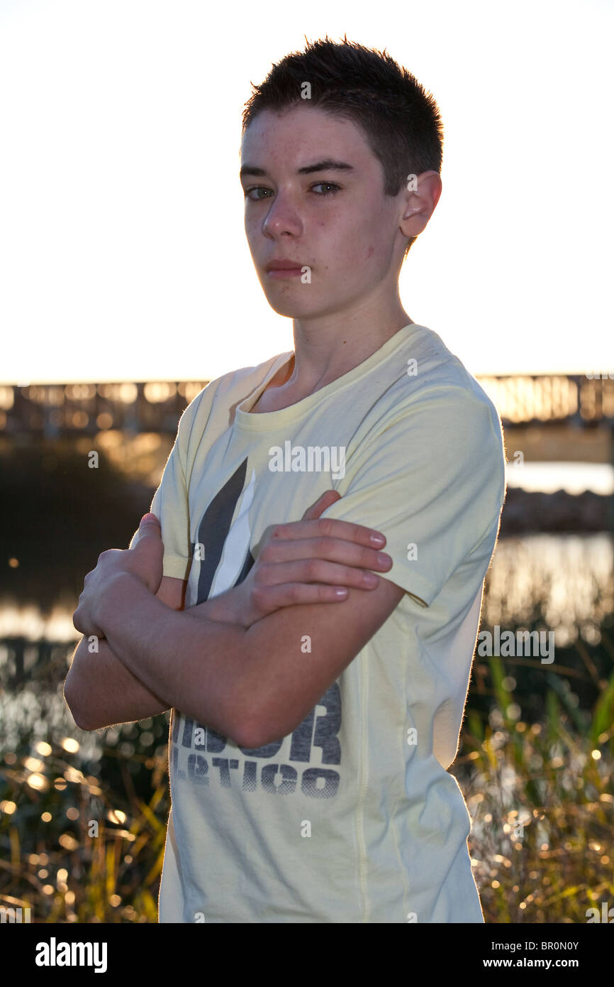 Teenage boy looking moody Stock Photo - Alamy
