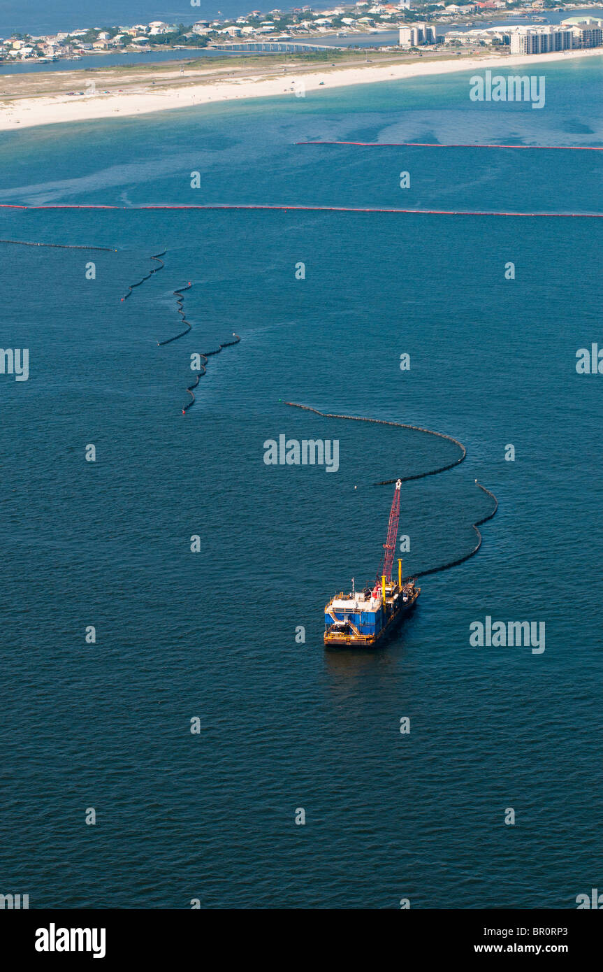 Vessel laying protective containment boom, Perdido Pass, Orange Beach ...
