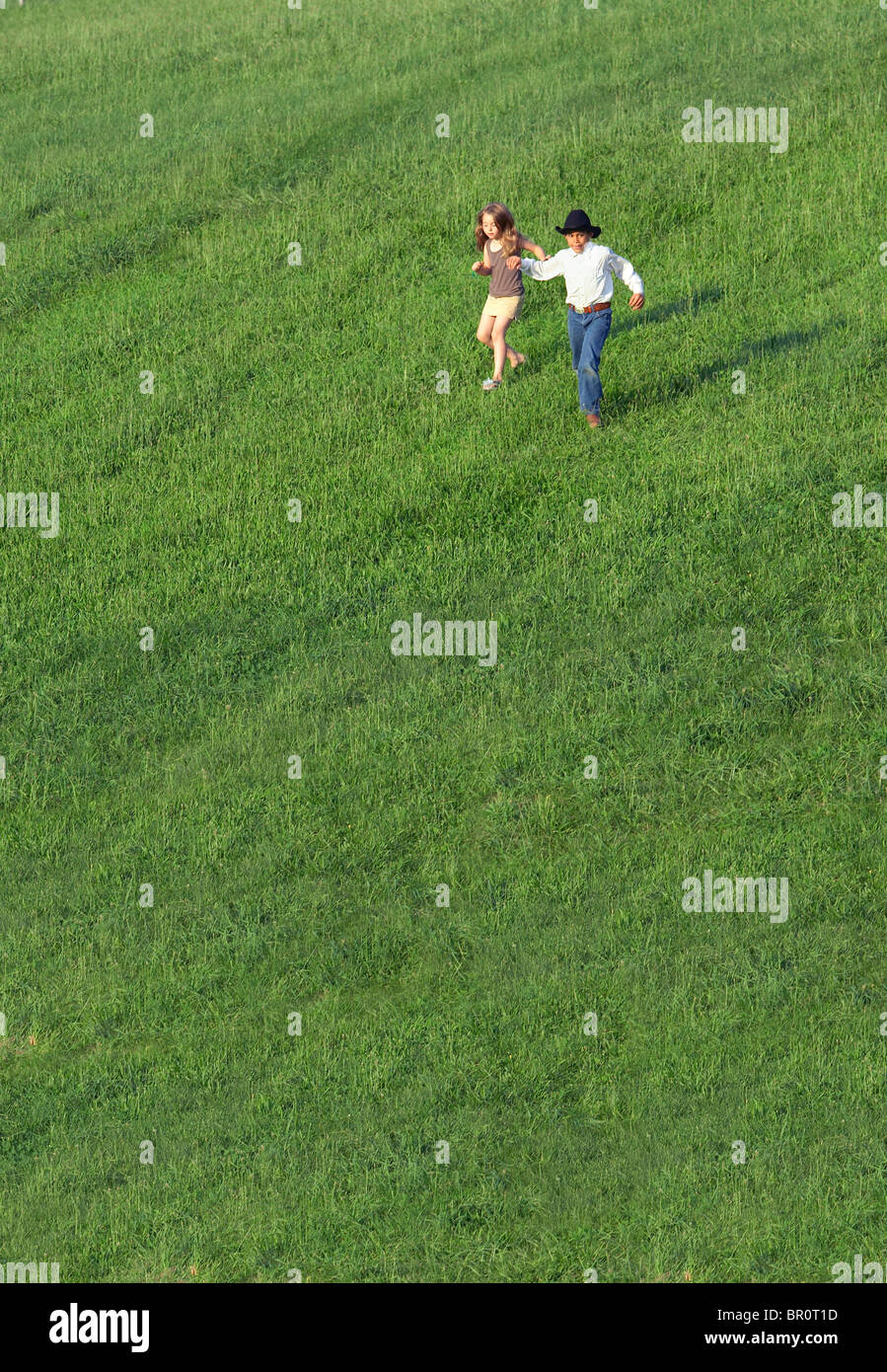 Children running down hill hi-res stock photography and images - Alamy