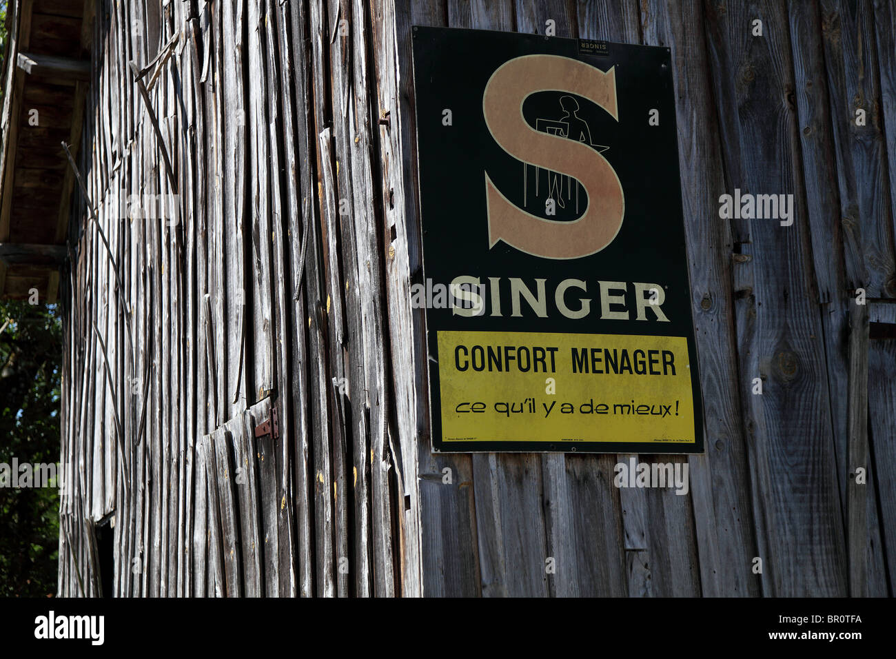 Singer advertising board Stock Photo - Alamy