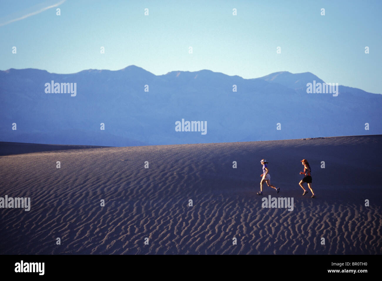 Athlete running on sand dunes hi-res stock photography and images - Alamy