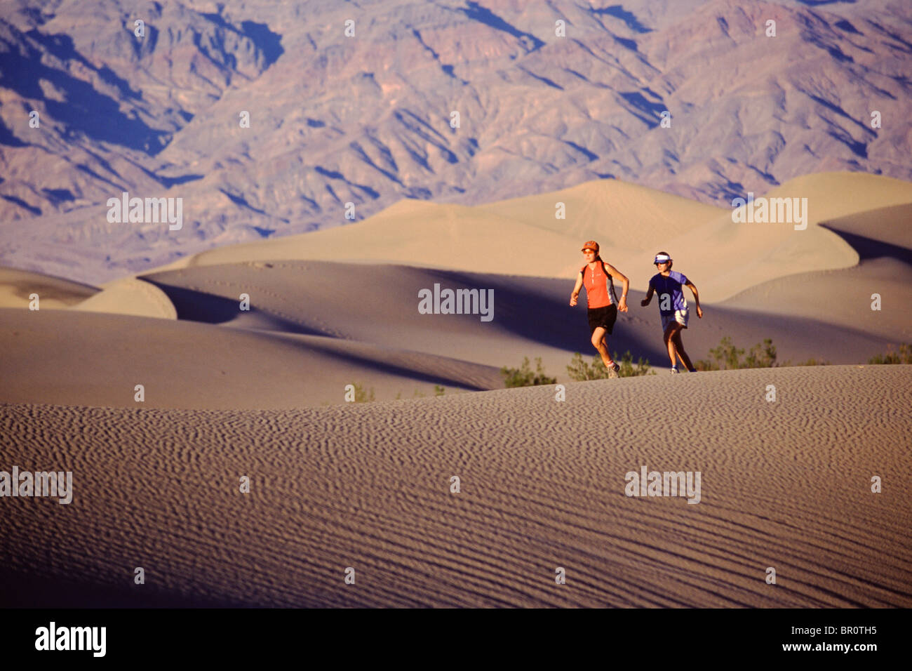 Athlete running on sand dunes hi-res stock photography and images - Alamy