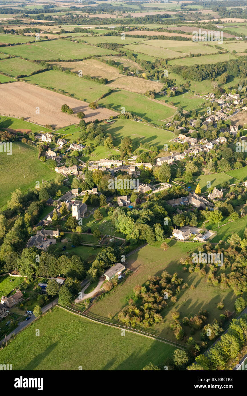 An aerial view of the Cotswold village of Naunton, Gloucestershire from ...