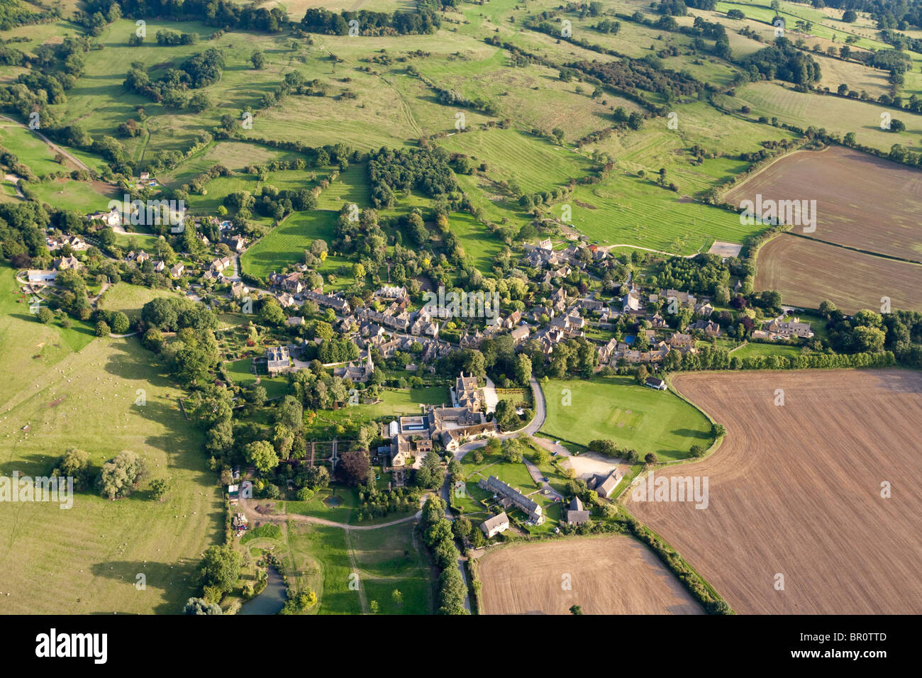 An aerial view of the Cotswold village of Stanton, Gloucestershire from ...