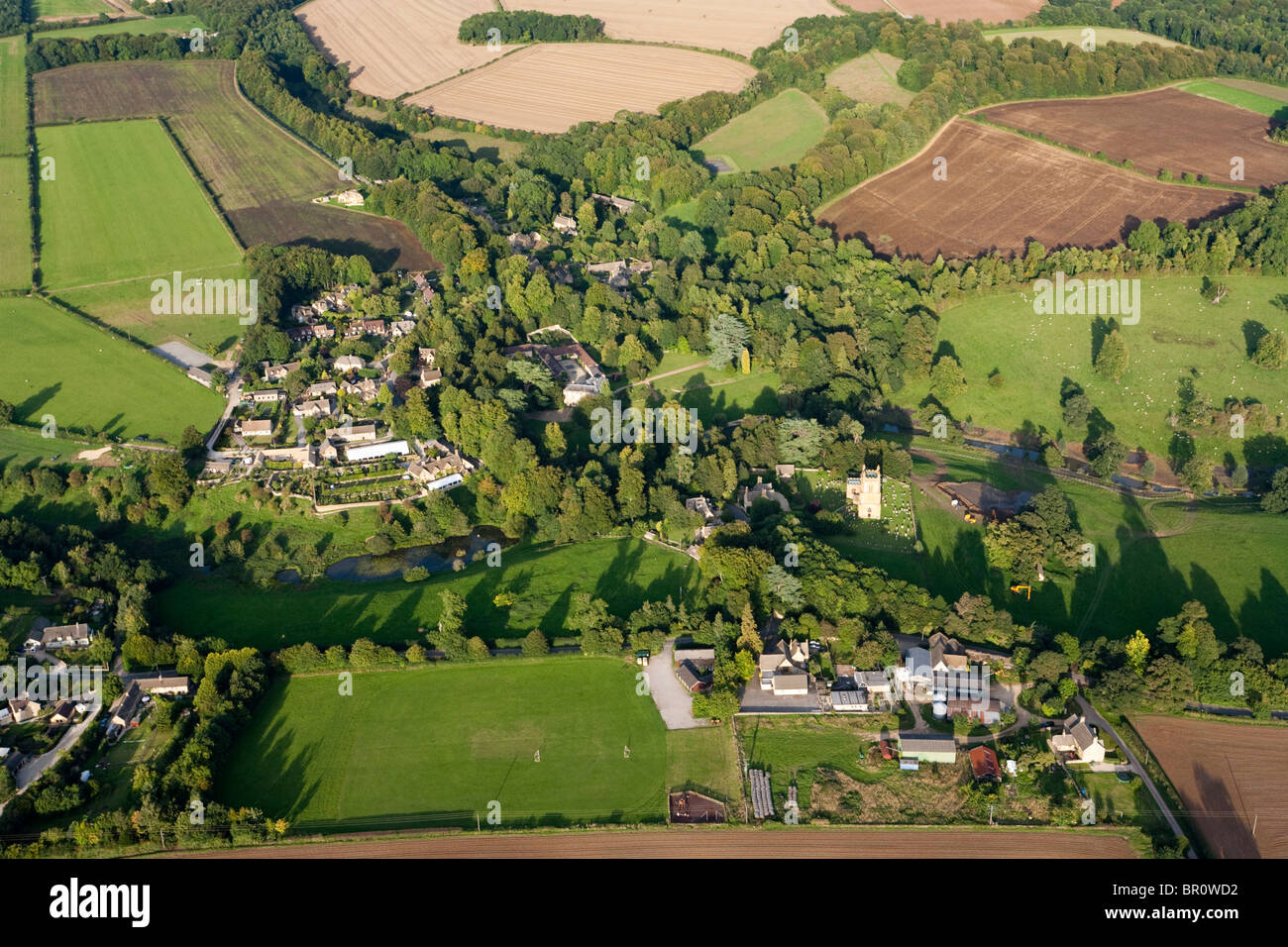 An aerial view of the Cotswold village of Temple Guiting ...