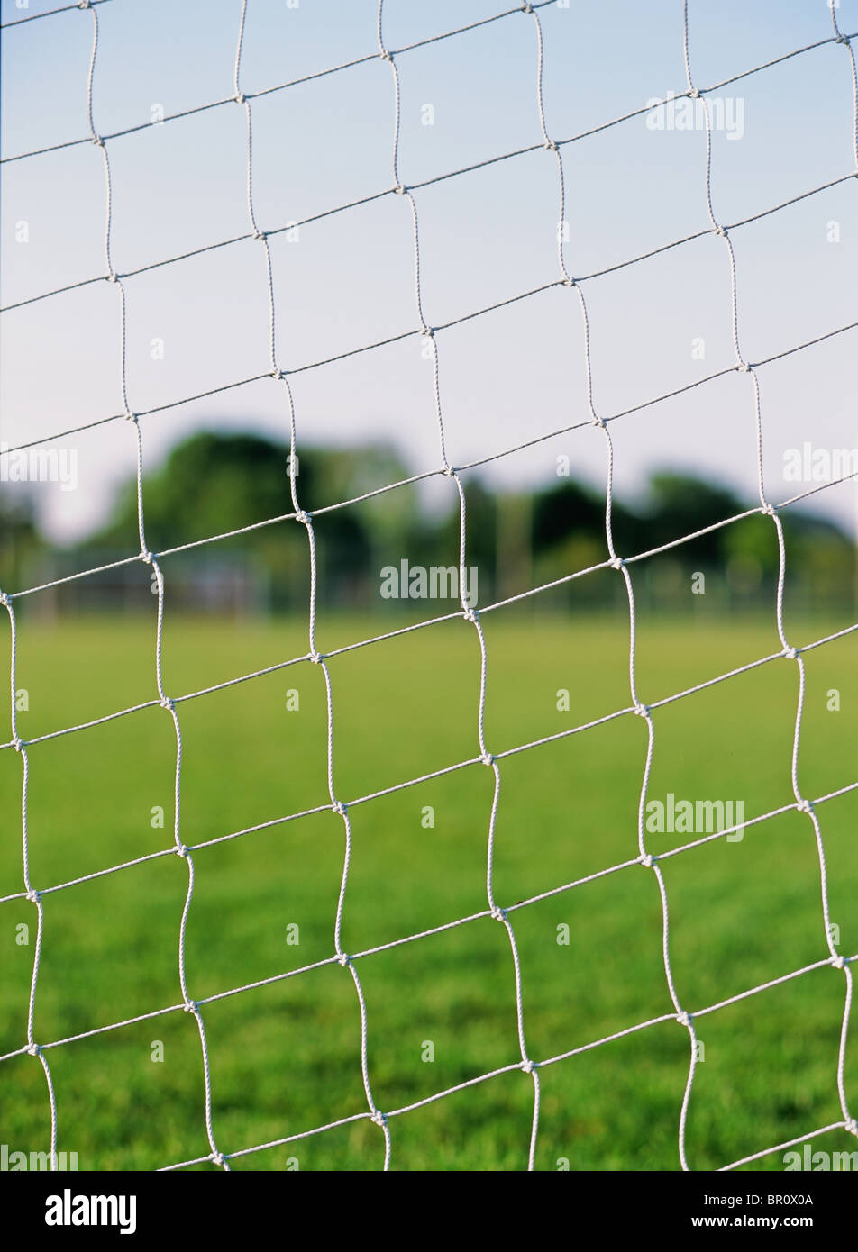 Football goal netting with blur background Stock Photo - Alamy