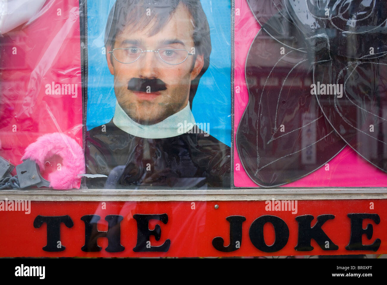 The Joke - shop window with Vicar's costume Stock Photo - Alamy