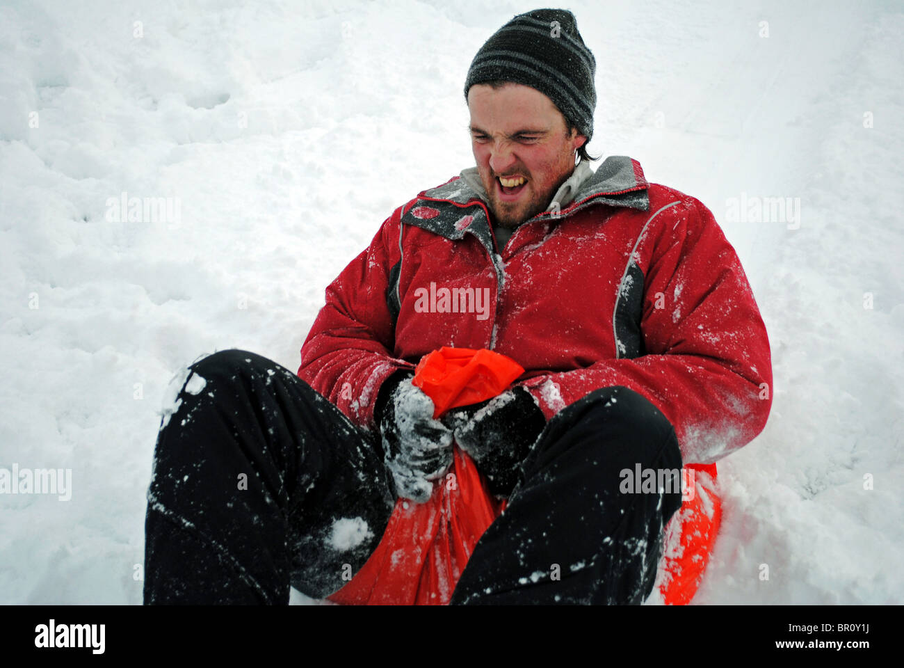 man sliding in the snow Stock Photo - Alamy
