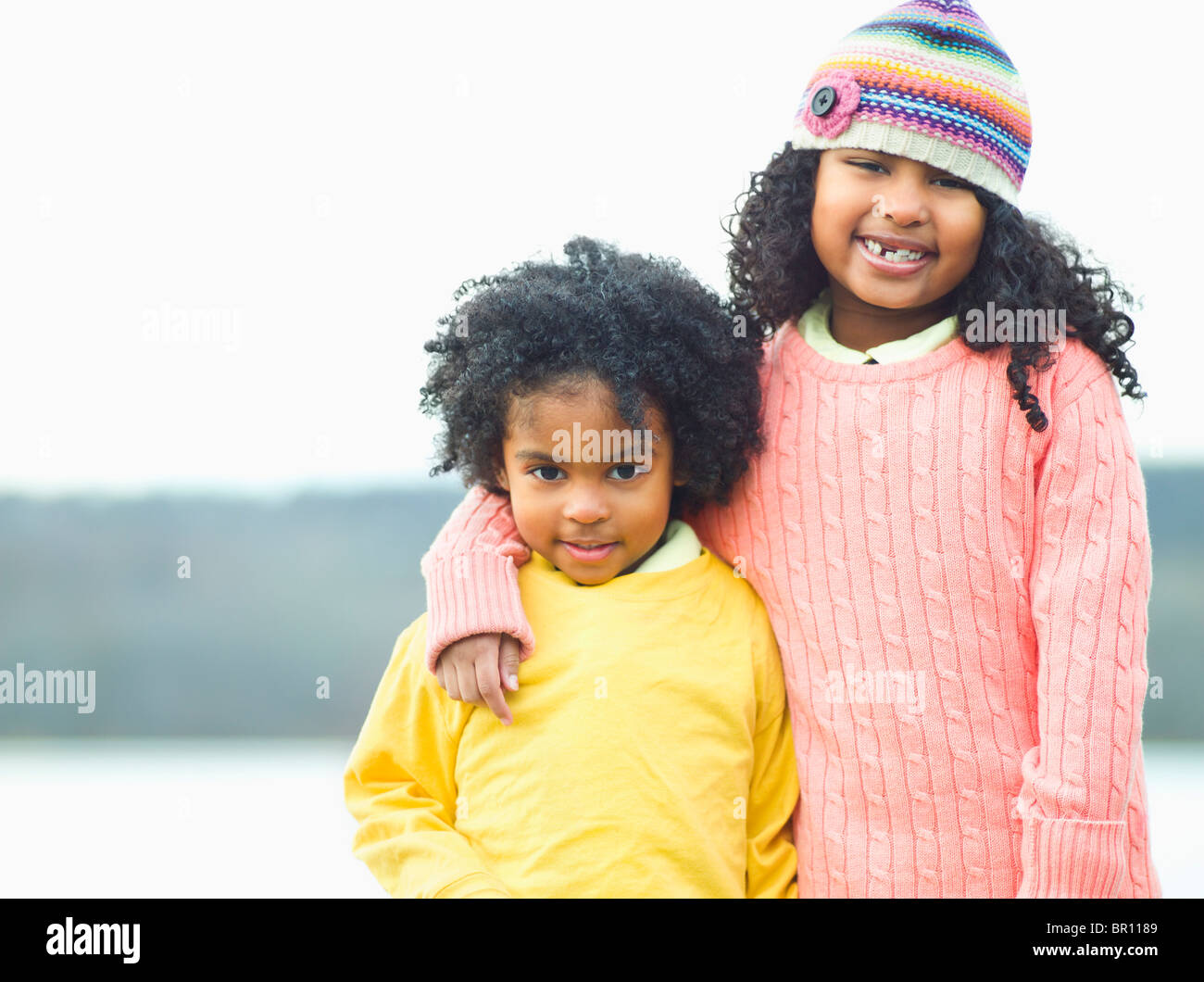 Mixed race children posing outdoors Stock Photo - Alamy