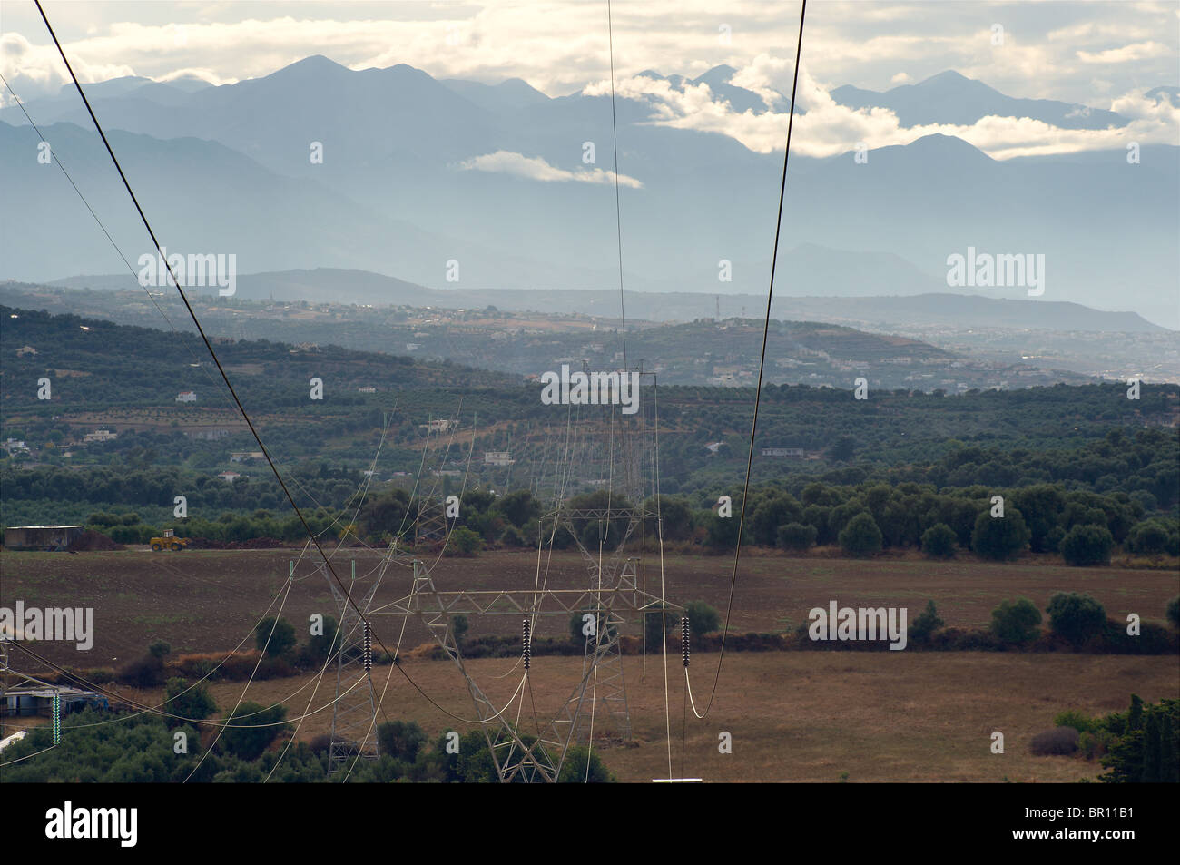Electricity pylon cables with distant mountains Crete Greece Stock ...