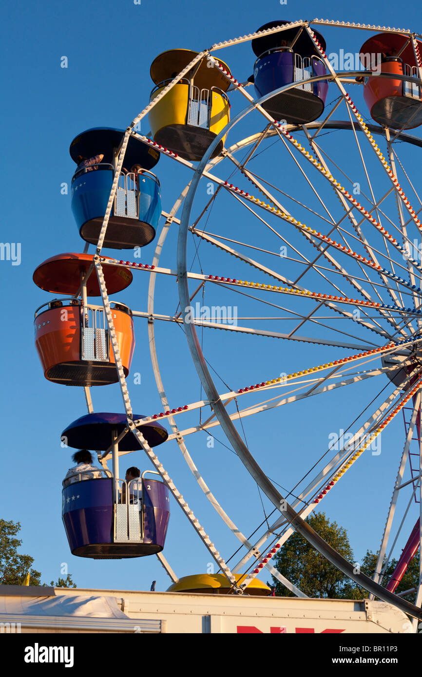 A small ferris wheel on a bright sunny day vertical. Canada Day ...