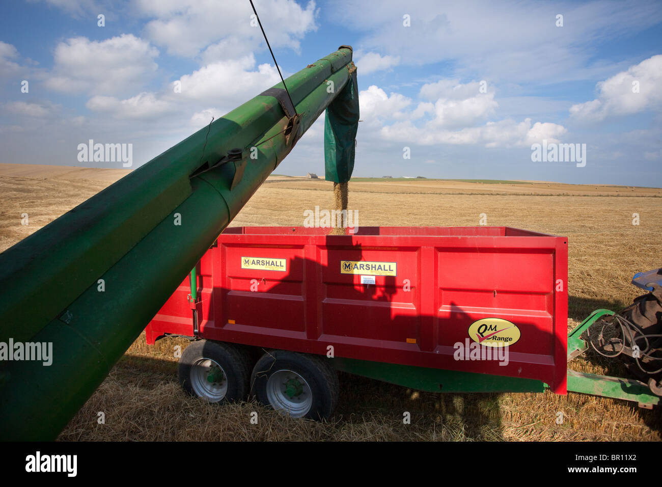 Combine harvester discharging grain hi-res stock photography and images ...