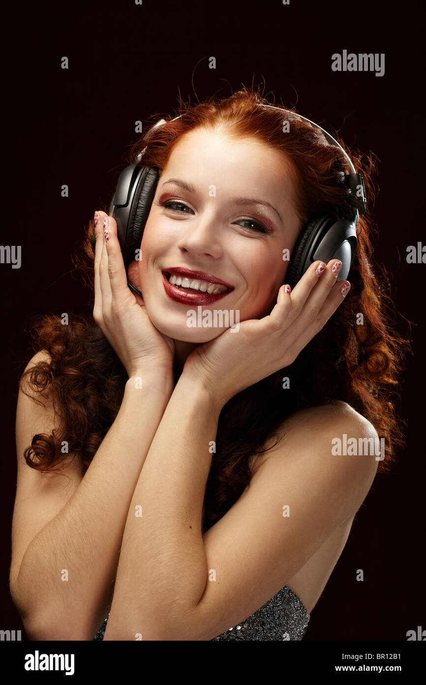 Beautiful women listening music Stock Photo - Alamy